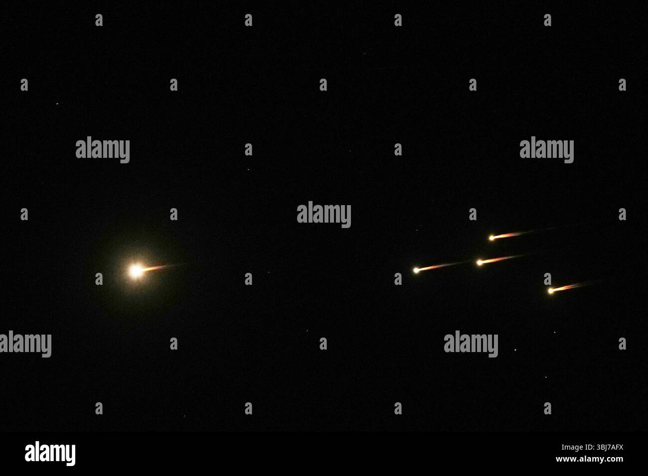 Missiles illuminate the night sky Jerusalem during an Iranian missile ...