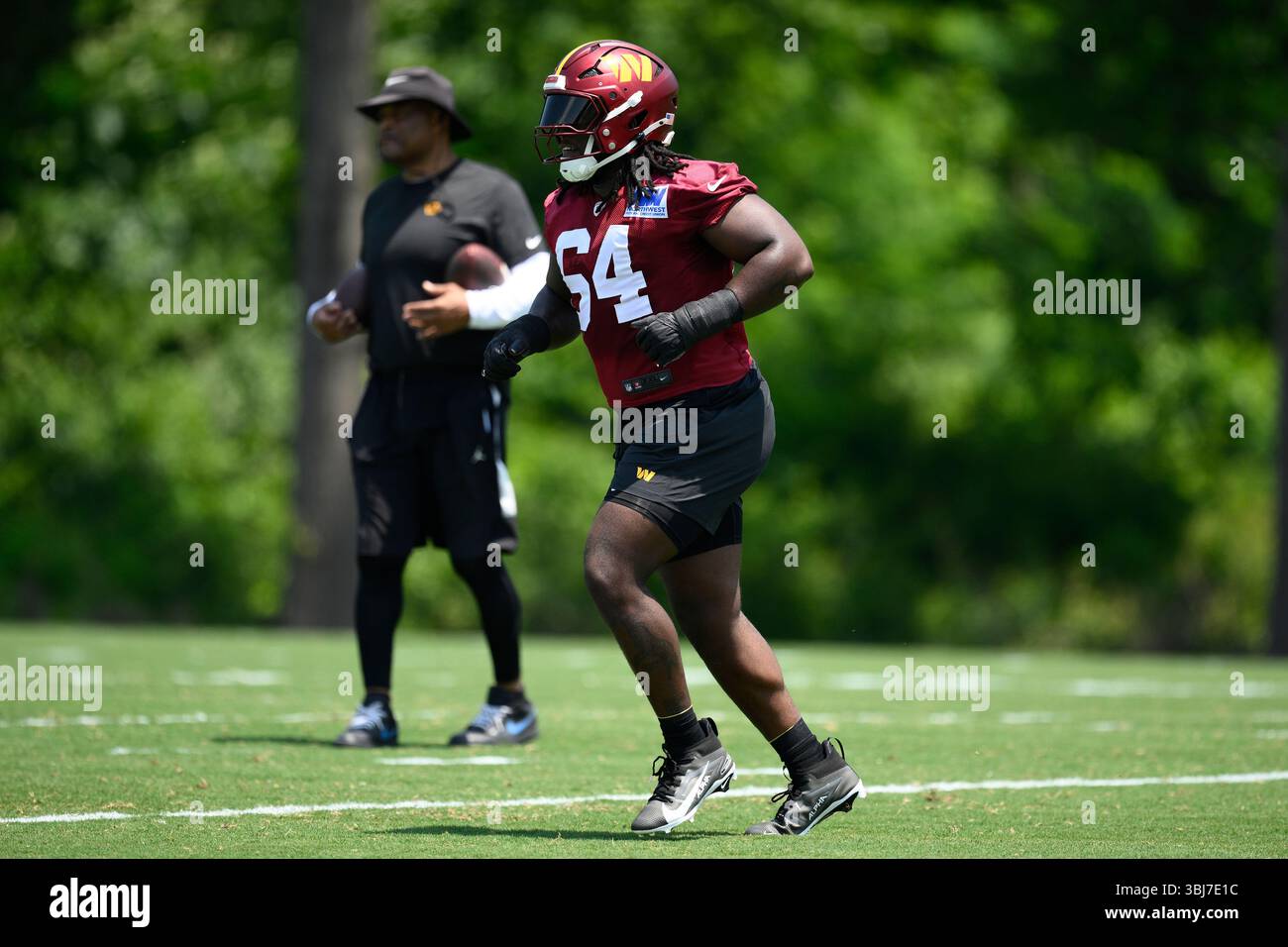 Washington Commanders defensive end Norell Pollard (64) works out ...