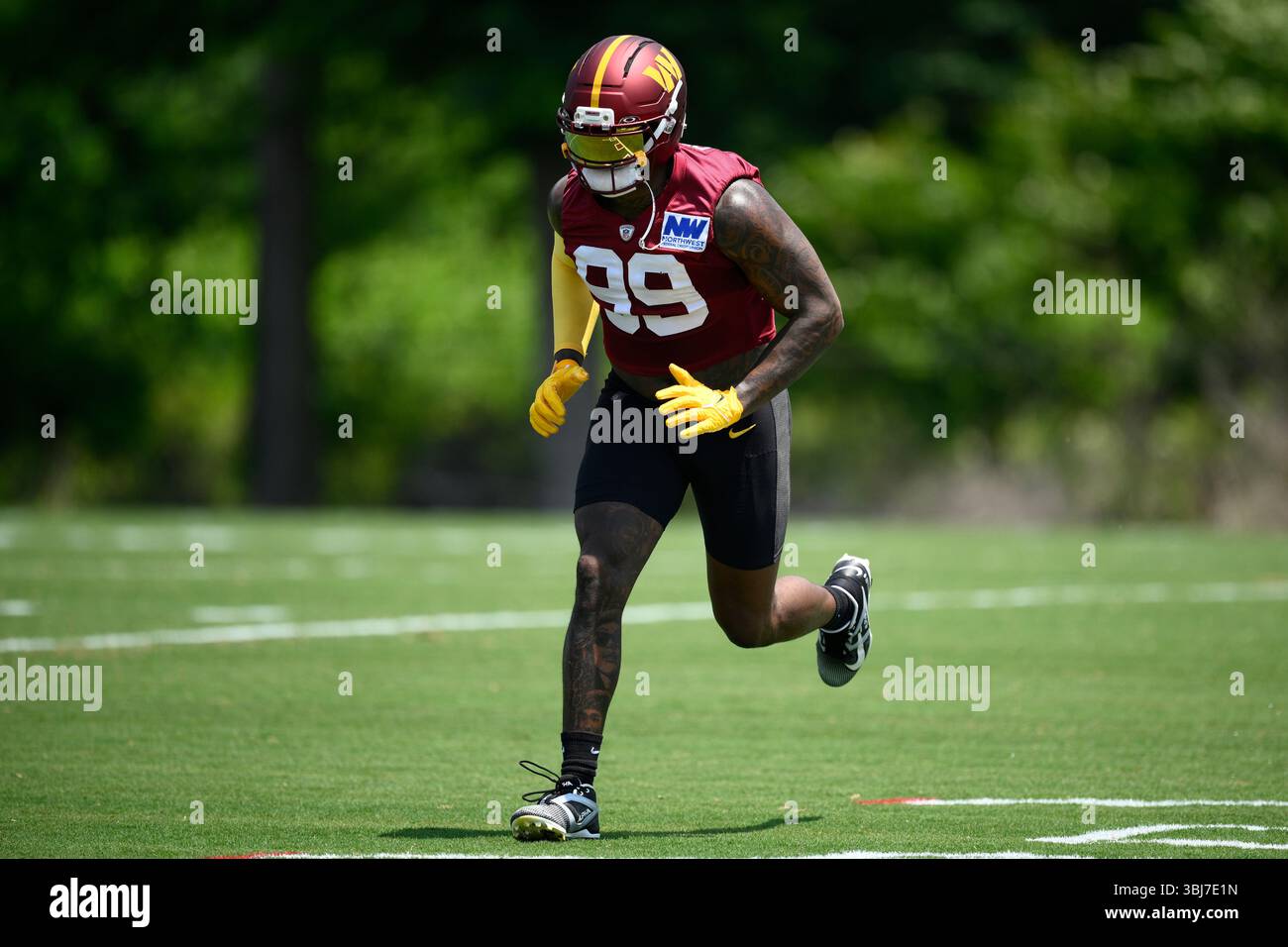 Washington Commanders defensive end Clelin Ferrell (99) works out ...