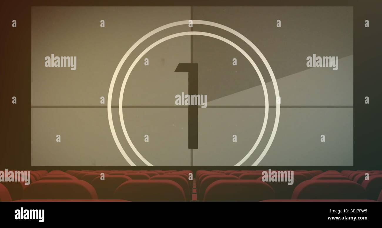 Projection screen displaying vintage film countdown in movie theater, with red theater seats ...