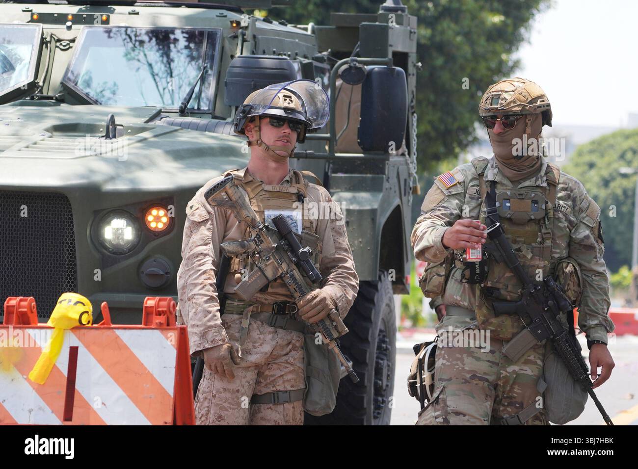 A U.S Marine, left, and a member of the California National Guard work ...