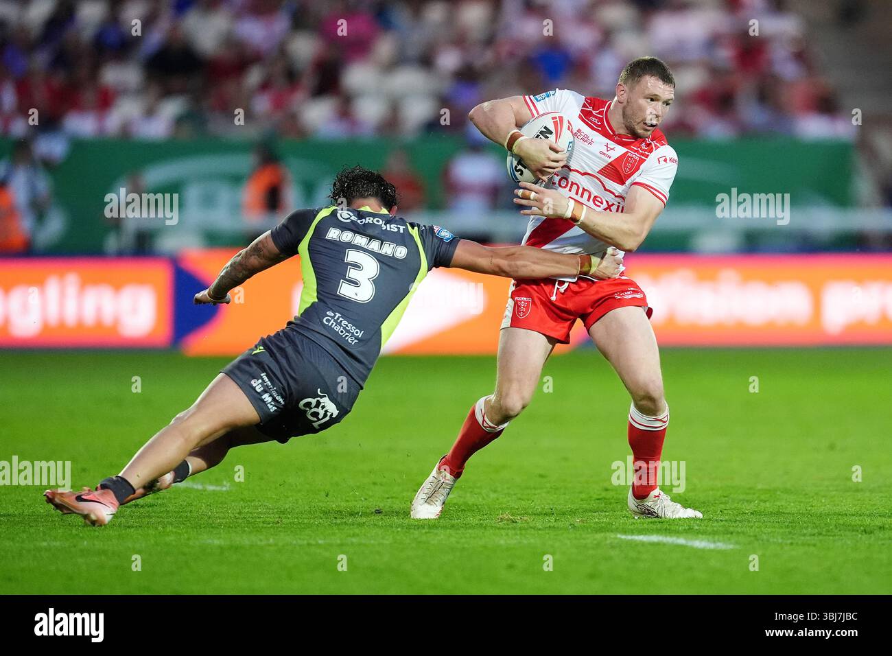 Hull KR's James Batchelor (right) and Catalans Dragons' Arthur Romano in action during the ...