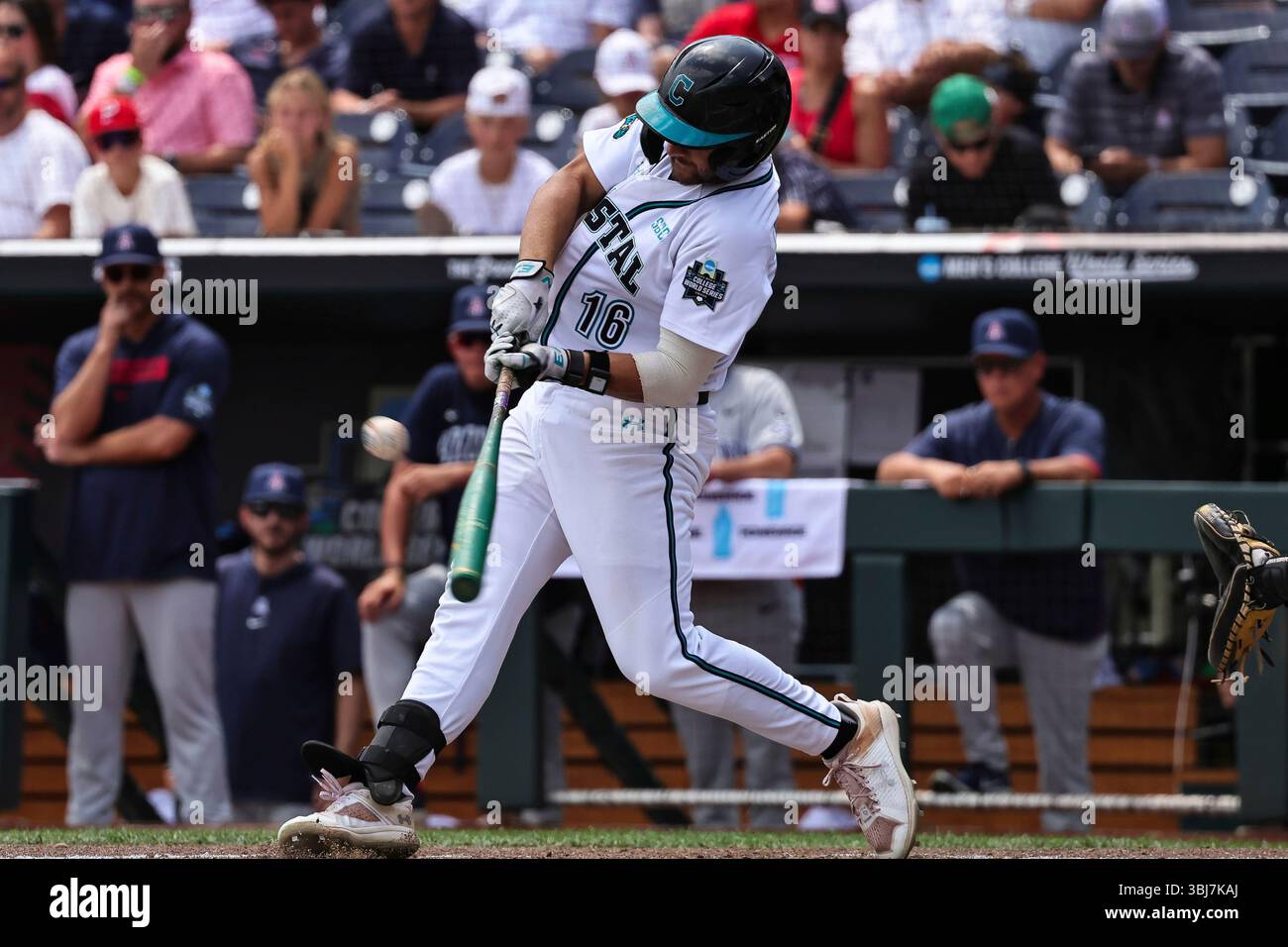 Coastal Carolina first baseman Colby Thorndyke (16) hits a line drive ...