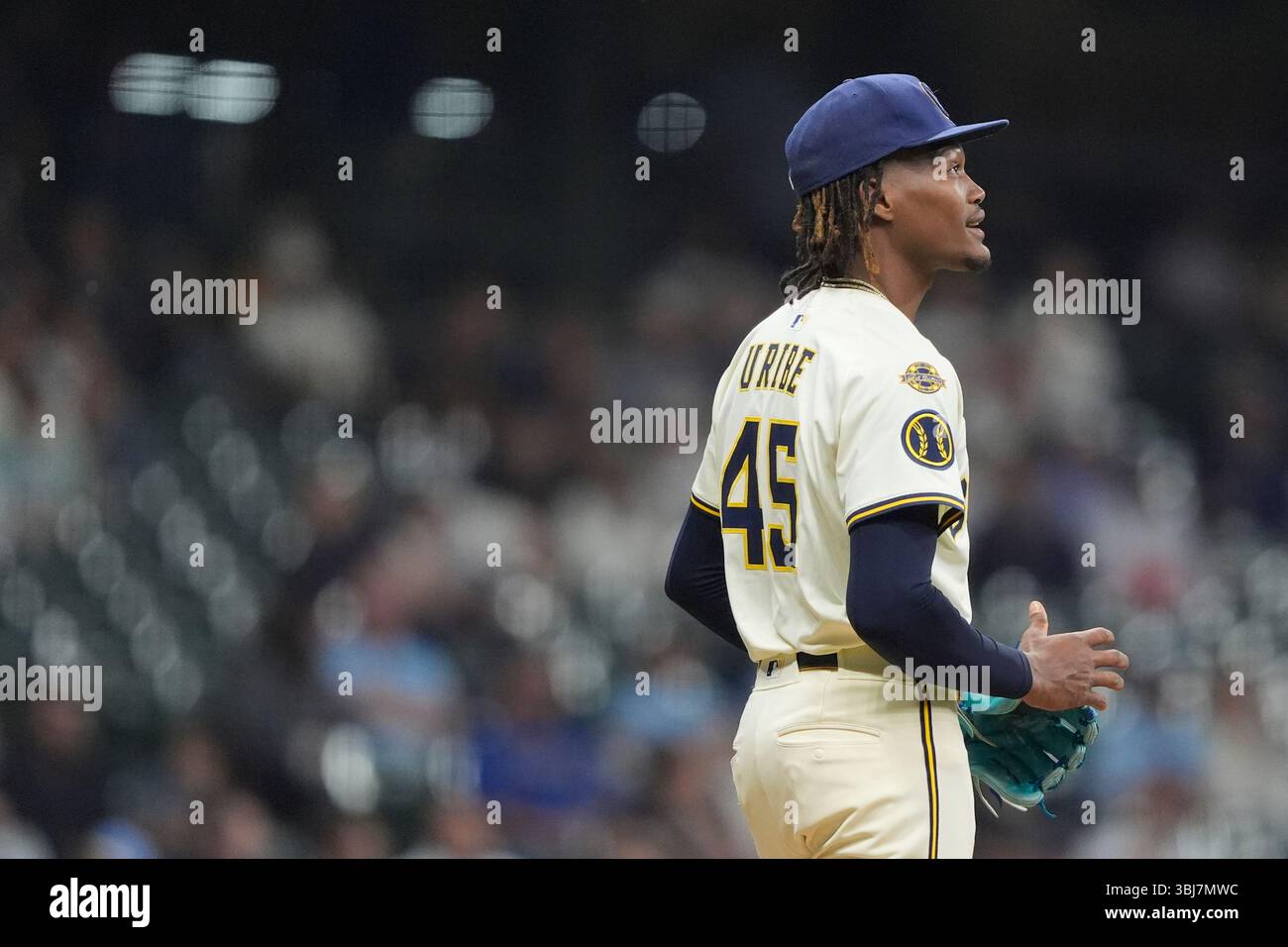 Milwaukee Brewers' Abner Uribe looks on during a baseball game against ...