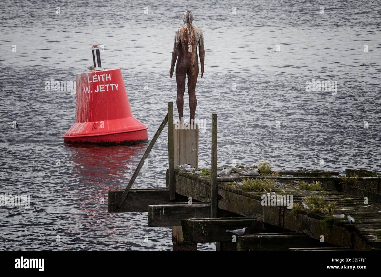 File photo dated 15/06/19 of 'Leith Docks Man' one of six life-size ...