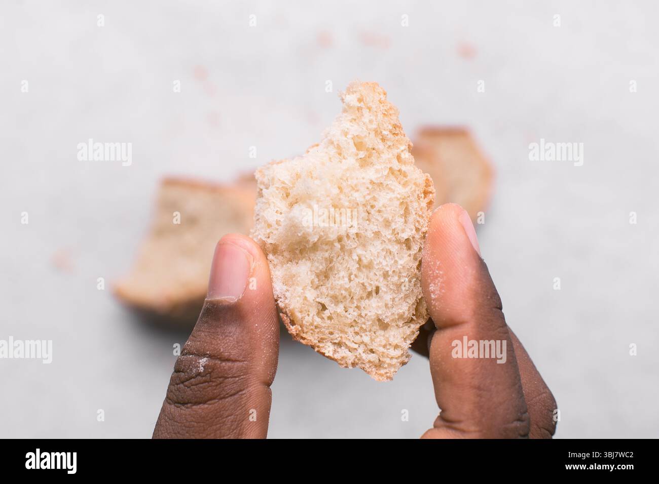 Overhead view of sliced homemade artisan bread on marble countertop ...