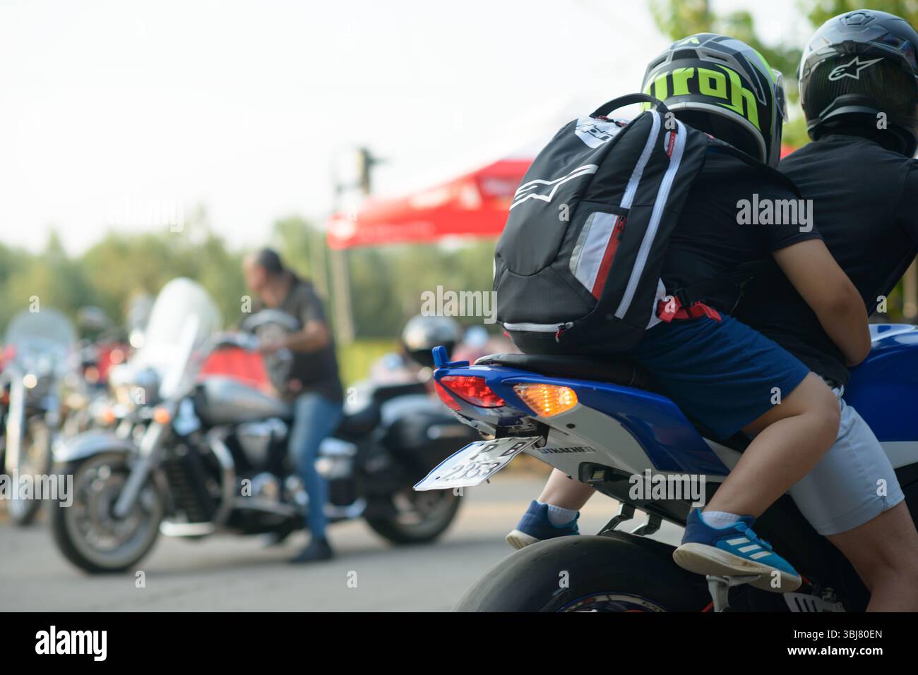 Child Riding Pillion with Backpack at Moto Rock Fest in Ruse Stock ...