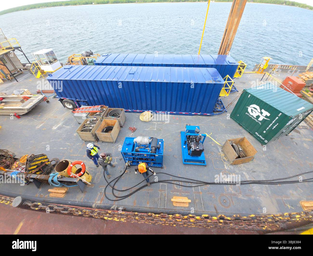Hay Lake Marine Casualty responders prepare containment tanks aboard a ...