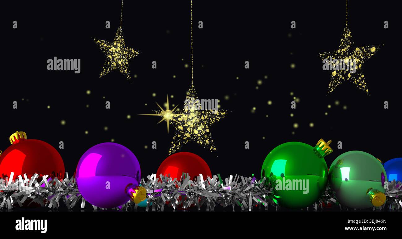 Displaying colorful Christmas baubles in silver tinsel on shelf, with ...