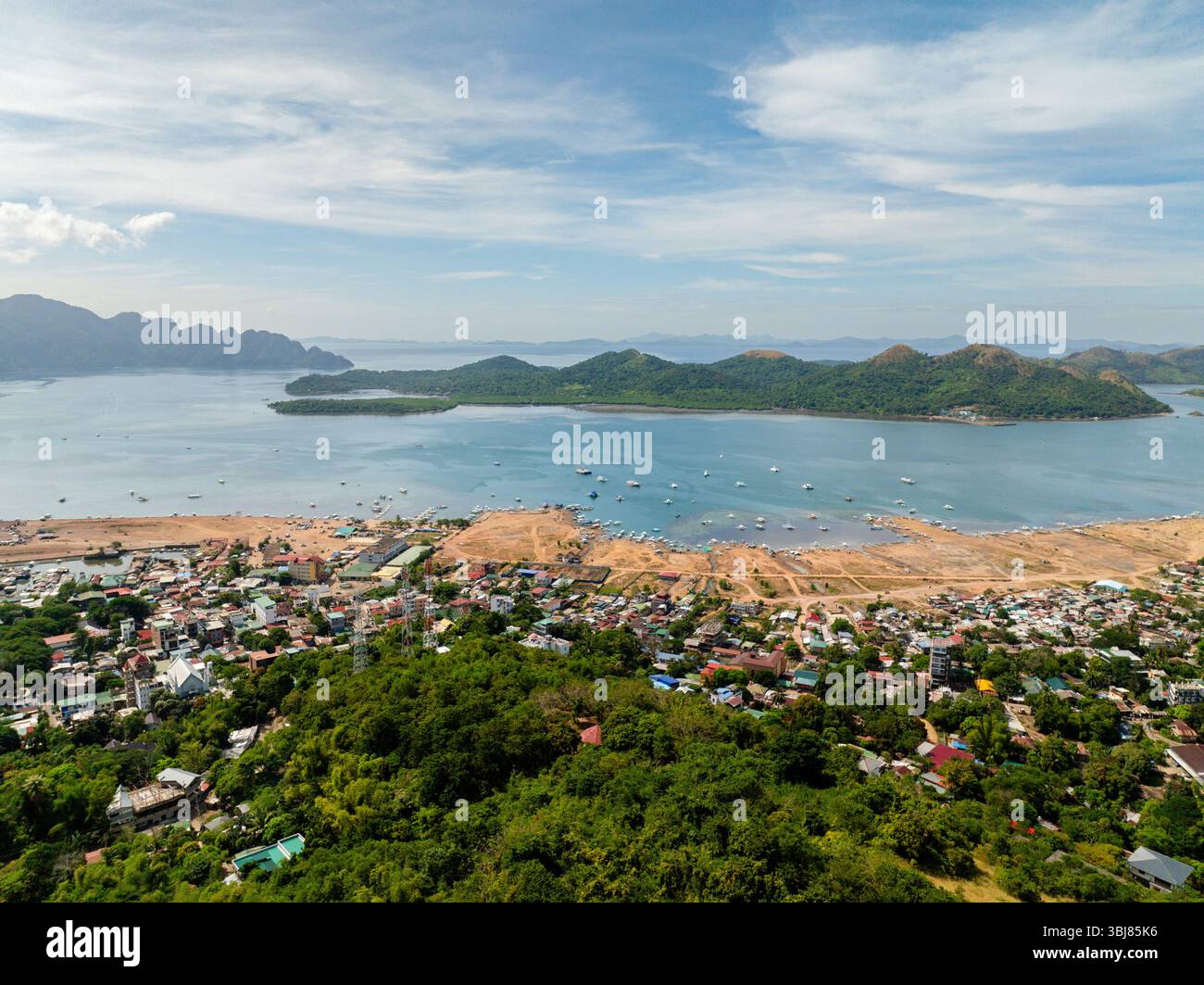 Drone view of Coastal City. Coron Town Proper. Blue sky and clouds ...