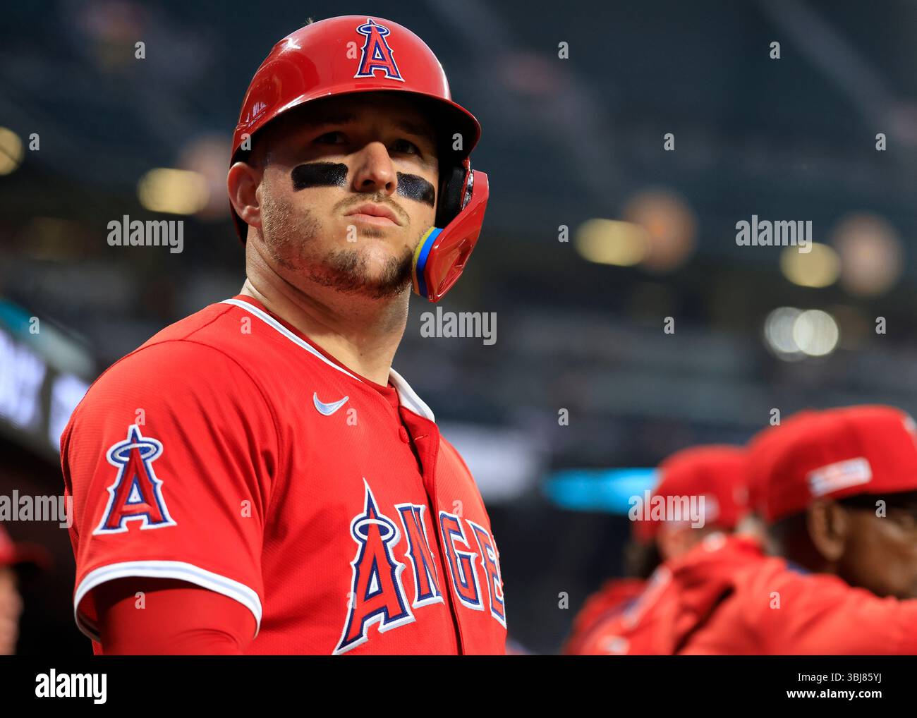 Los Angeles Angels' Mike Trout looks out into the crowd from the dugout ...