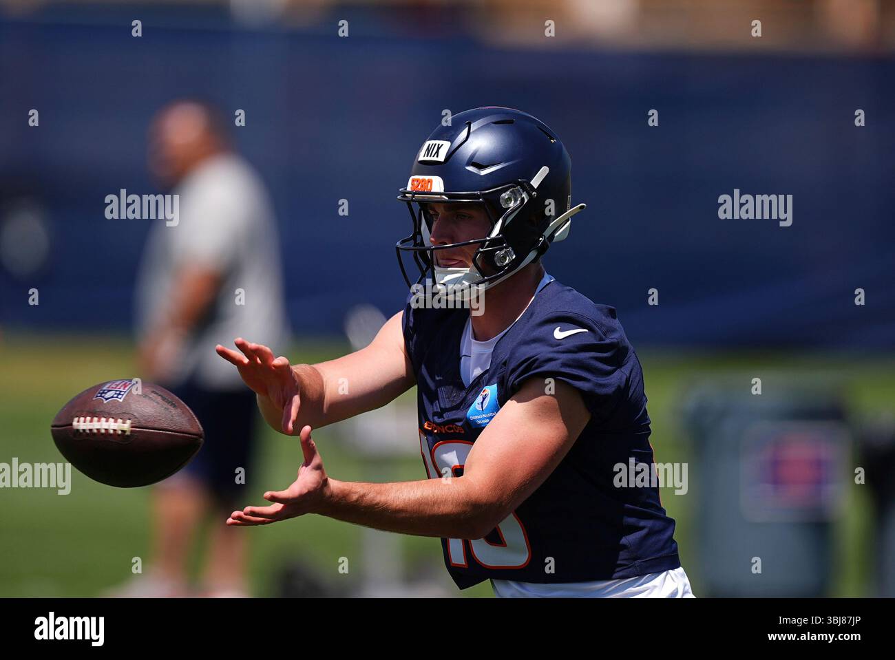 Denver Broncos quarterback Bo Nix (10) takes part in drills during an NFL football manadatory ...