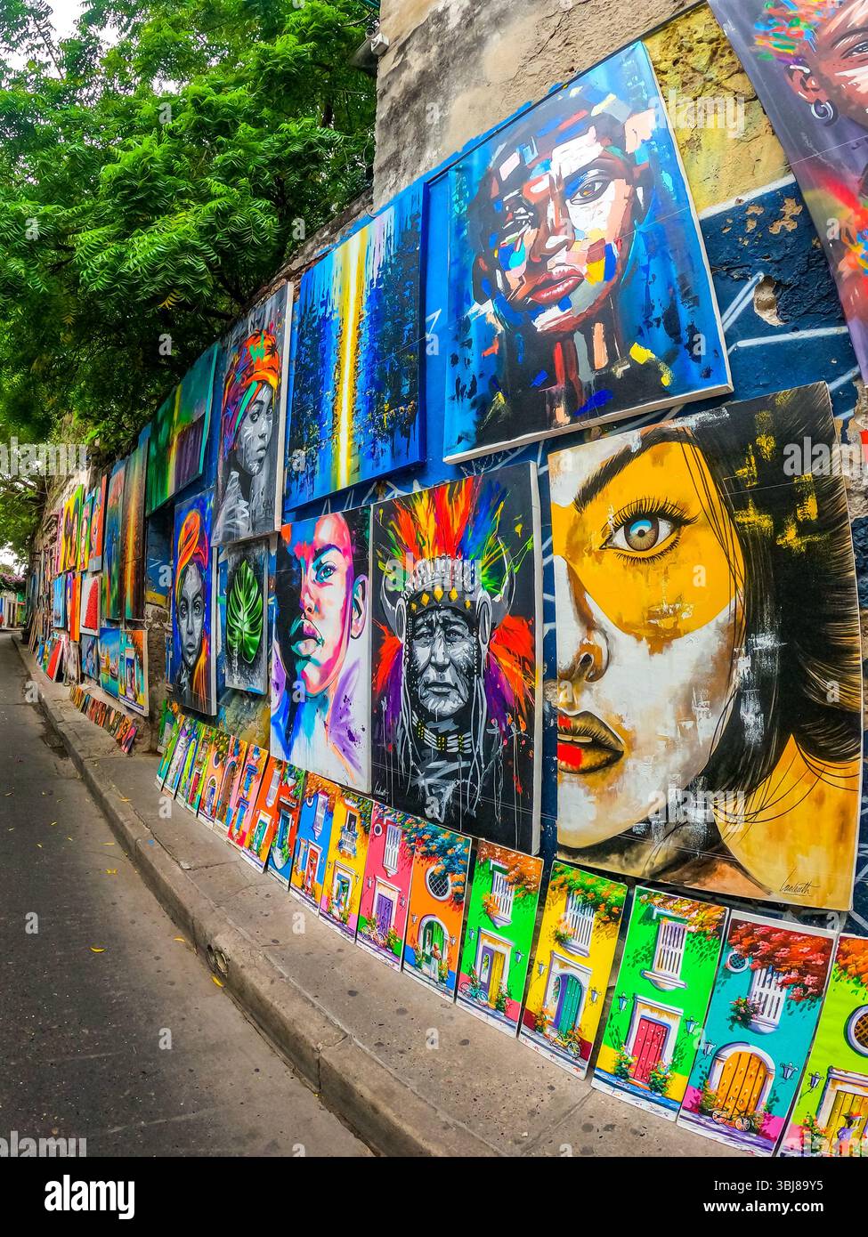 A vibrant display of street art showcasing various portraits and ...