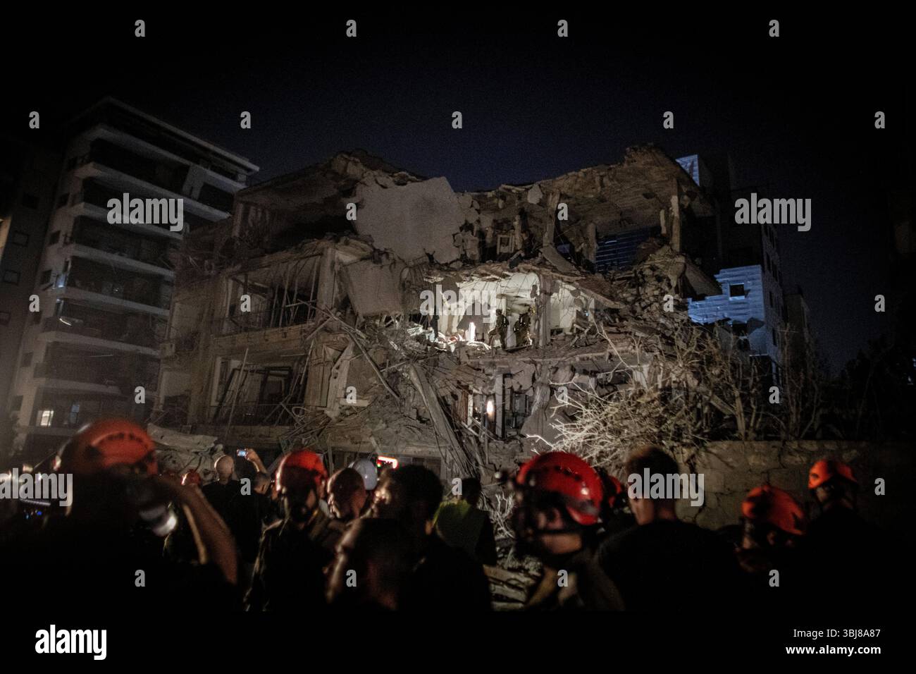 Israeli home front command soldiers next to a building that was hit in ...