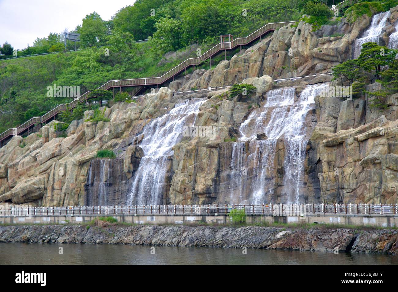 Incheon, South Korea - May 19th 2025: Water streams down the sculpted ...