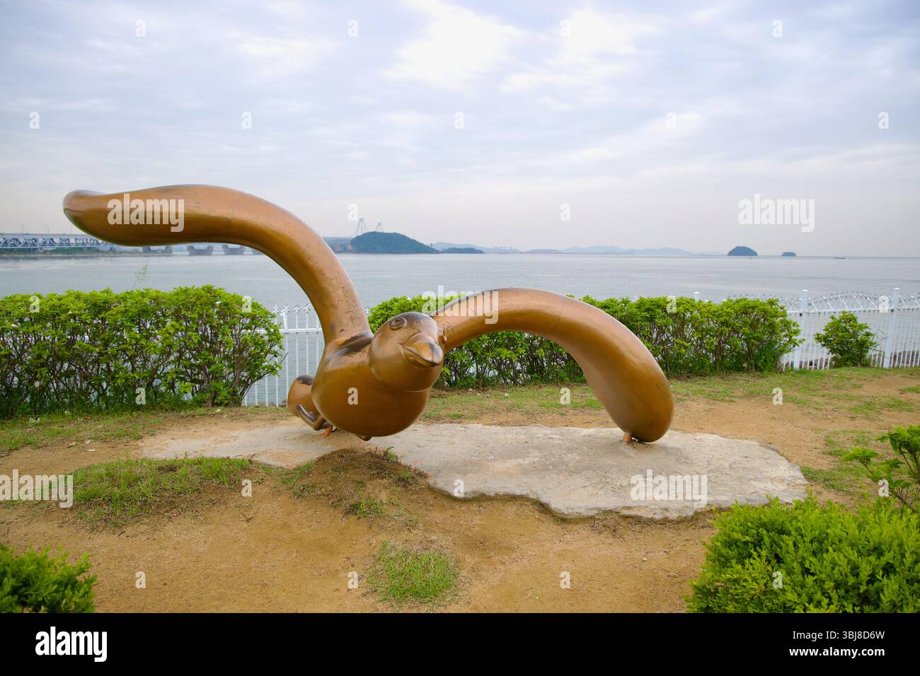Incheon, South Korea - May 19th 2025: A bronze seabird sculpture with ...