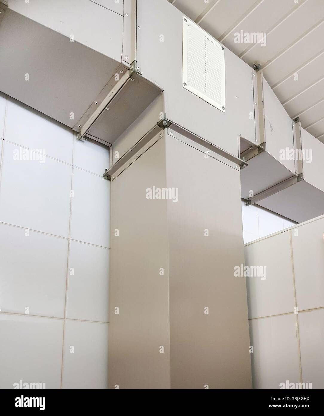 Industrial ventilation, air duct with metal box, indoors, vertical ...