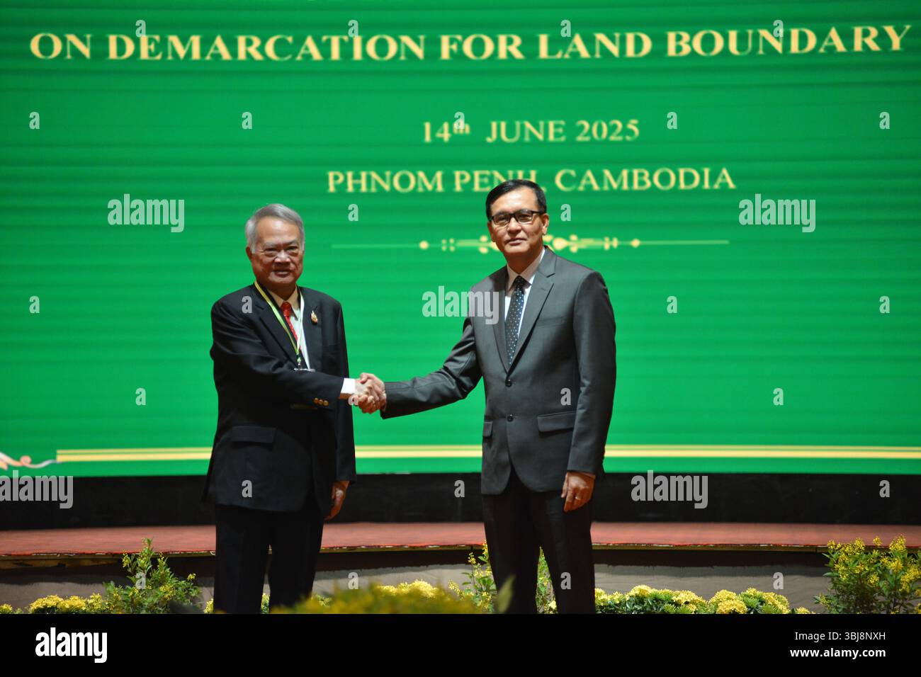 Phnom Penh, Cambodia. 14th June, 2025. Lam Chea (R), minister in charge of Cambodia's State ...