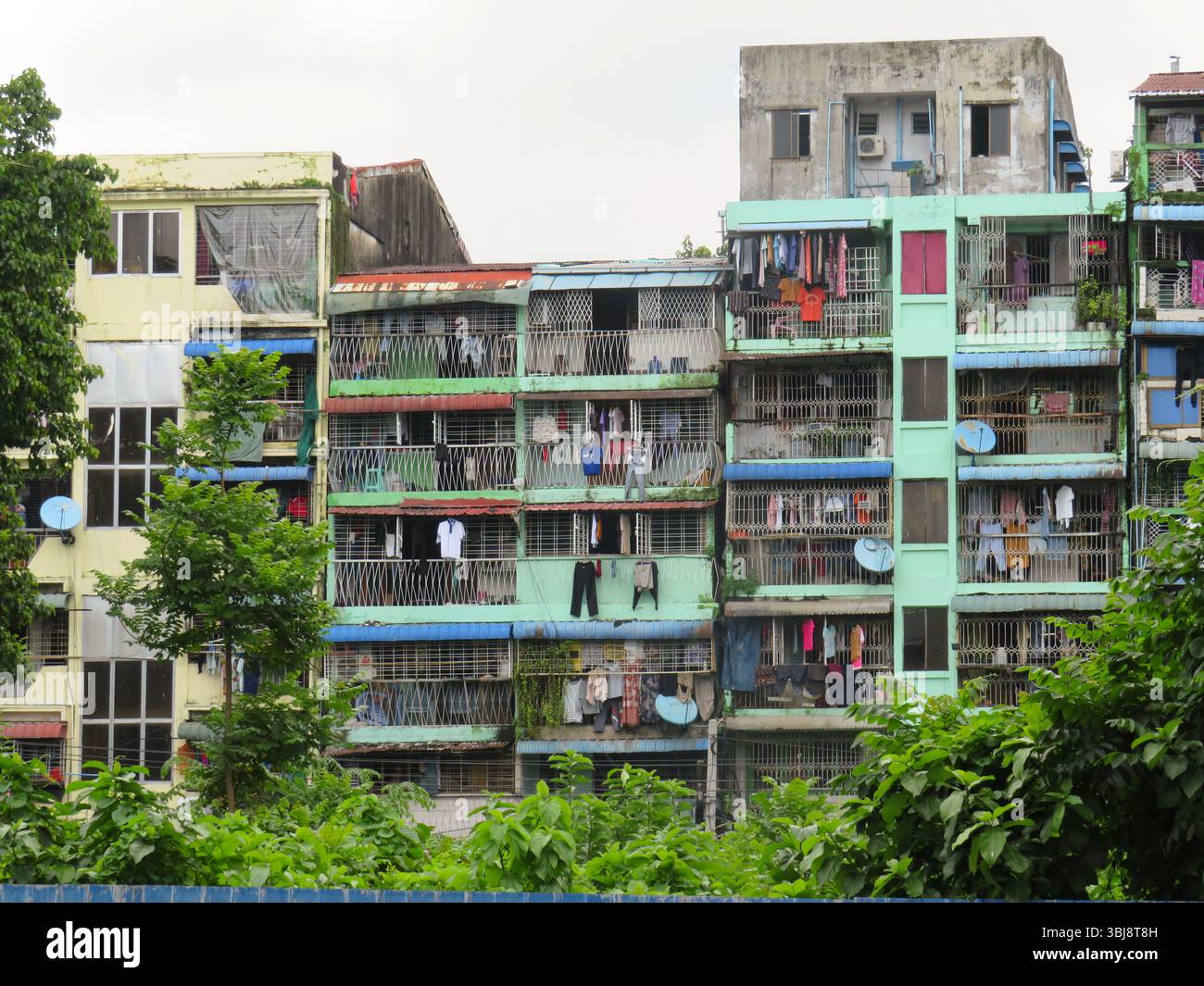8th June 2025 - Yangon, Myanmar - Apartment buildings with washing ...