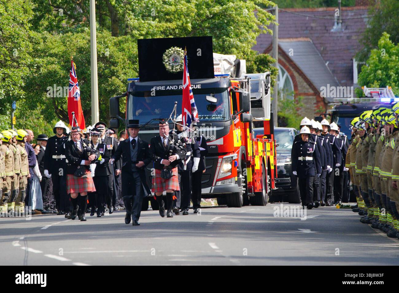 The cortege passing Bicester Fire Station, Oxfordshire, ahead of the ...