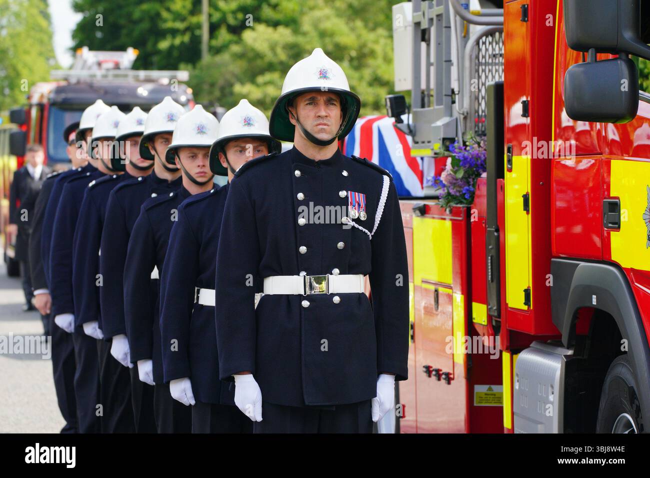 The cortege passing Bicester Fire Station, Oxfordshire, ahead of the ...