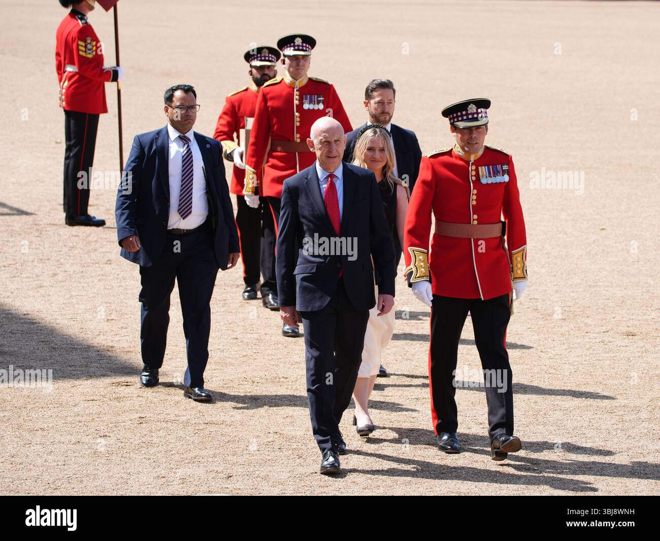 Defence Secretary John Healy (second left) arrives for the Trooping the ...