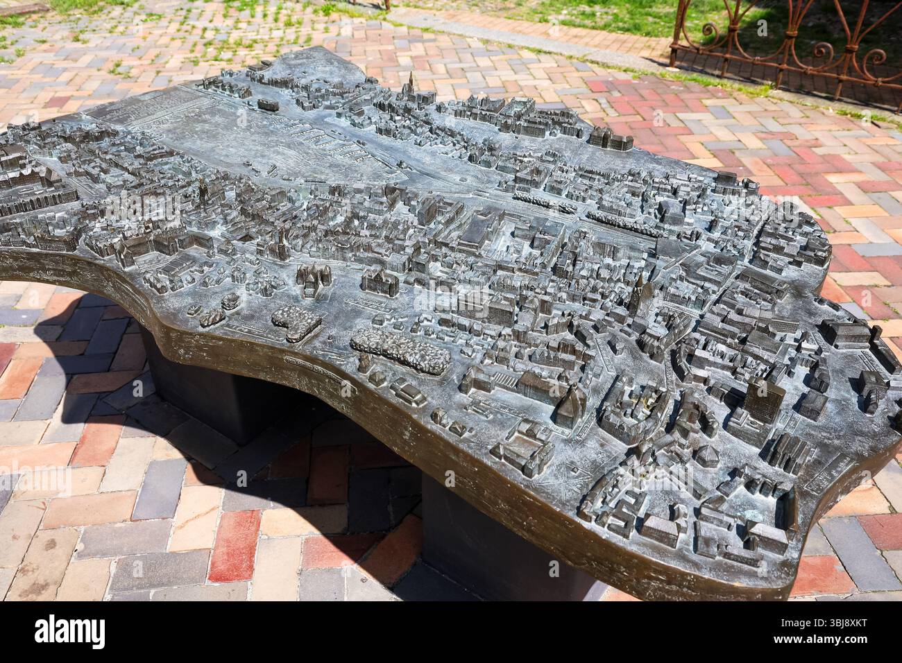 Flensburg, Germany - 13. June 2025: Detailed bronze miniature map of ...