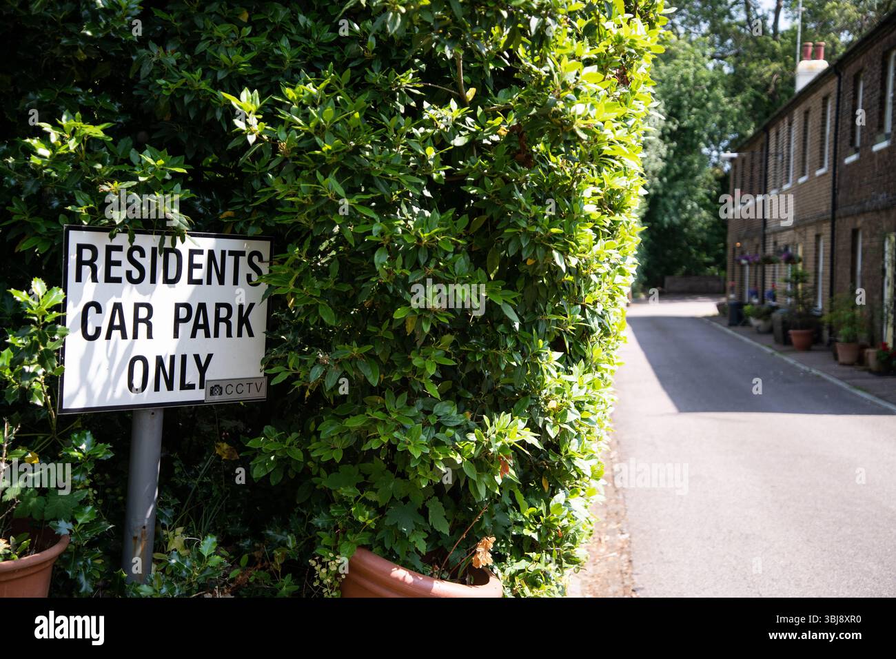 “Residents Car Park Only” sign on Government Row, indicating parking is ...