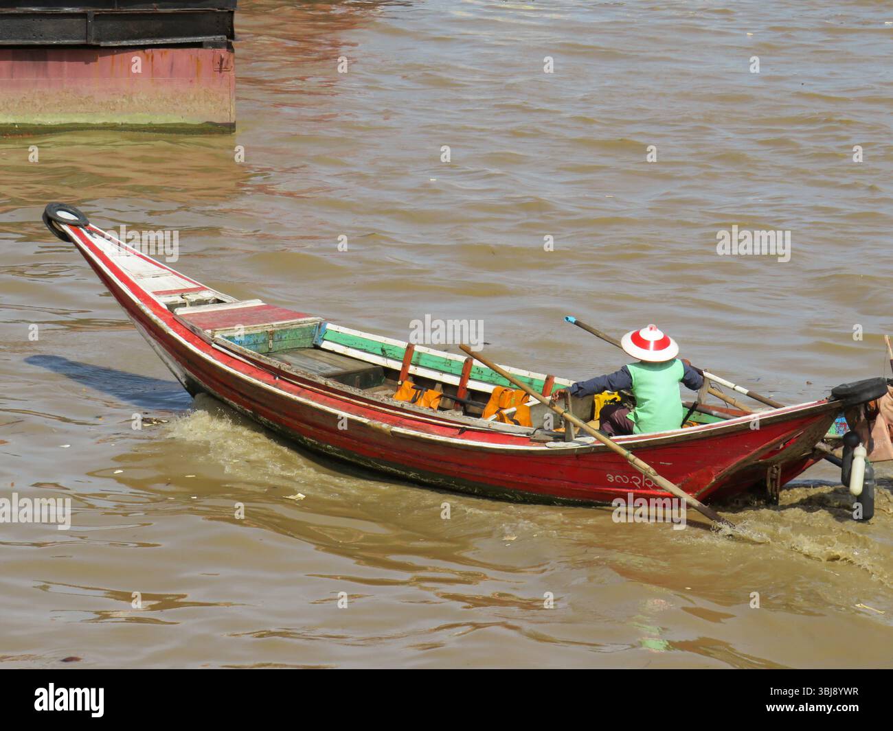 13th May 2025 - Yangon, Myanmar: A Fisherman in a small kayak on the ...