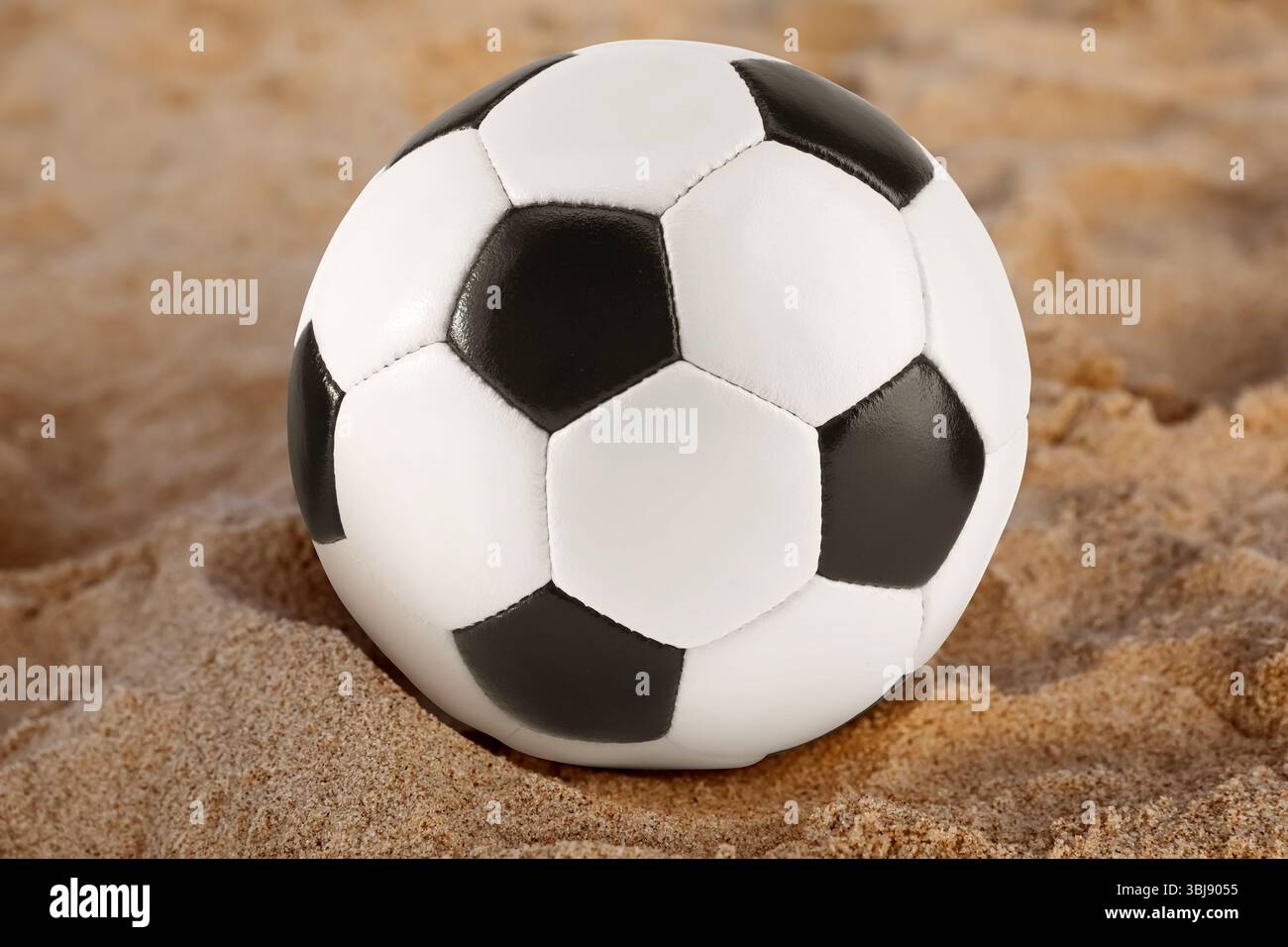 Beach football. Soccer ball on sand. Seasonal outdoor activity Stock ...