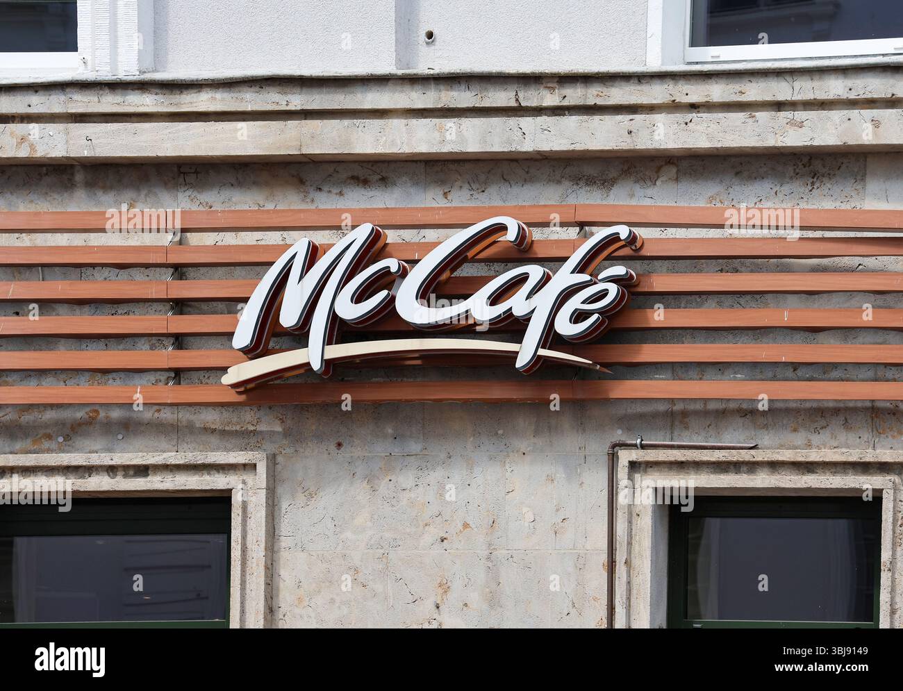 Flensburg, Germany - 13. June 2025: Close-up of the McCafe logo, showcasing the branding of ...