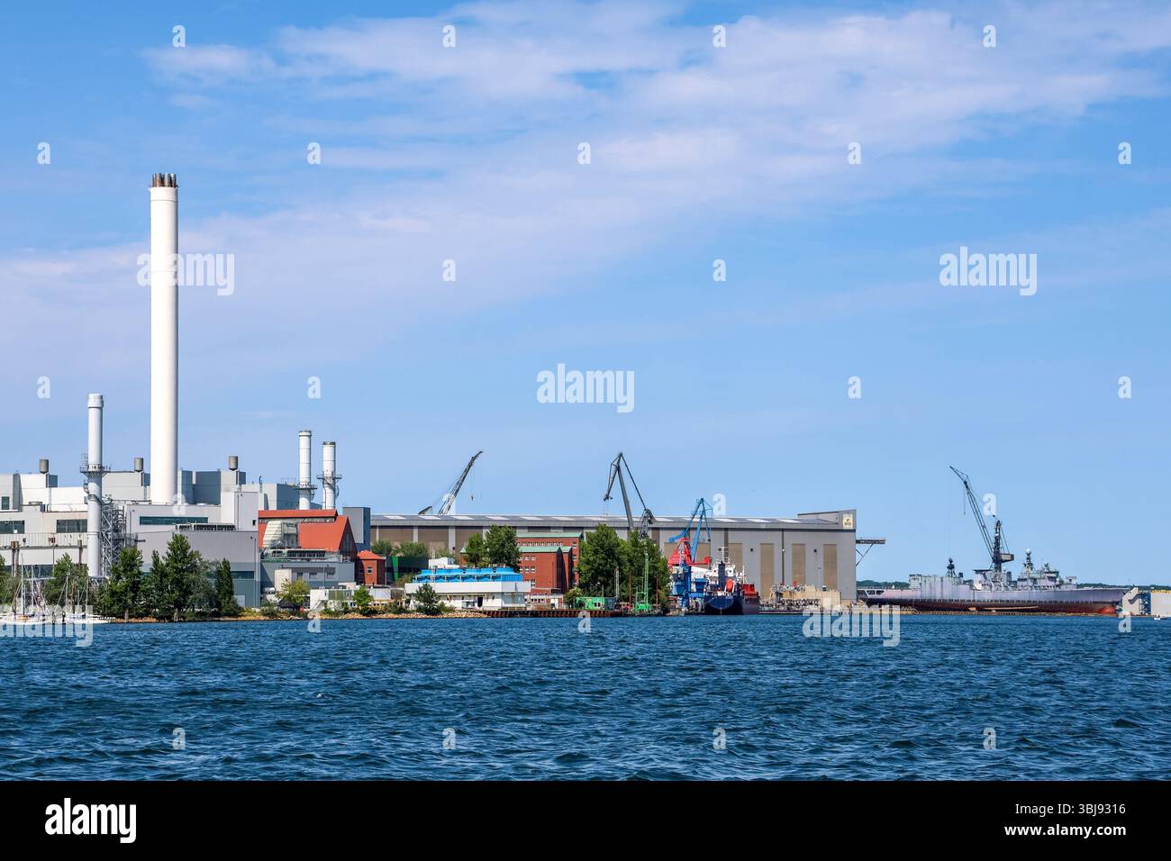 Flensburg harbor in Germany with industrial buildings, cranes, shipyard ...