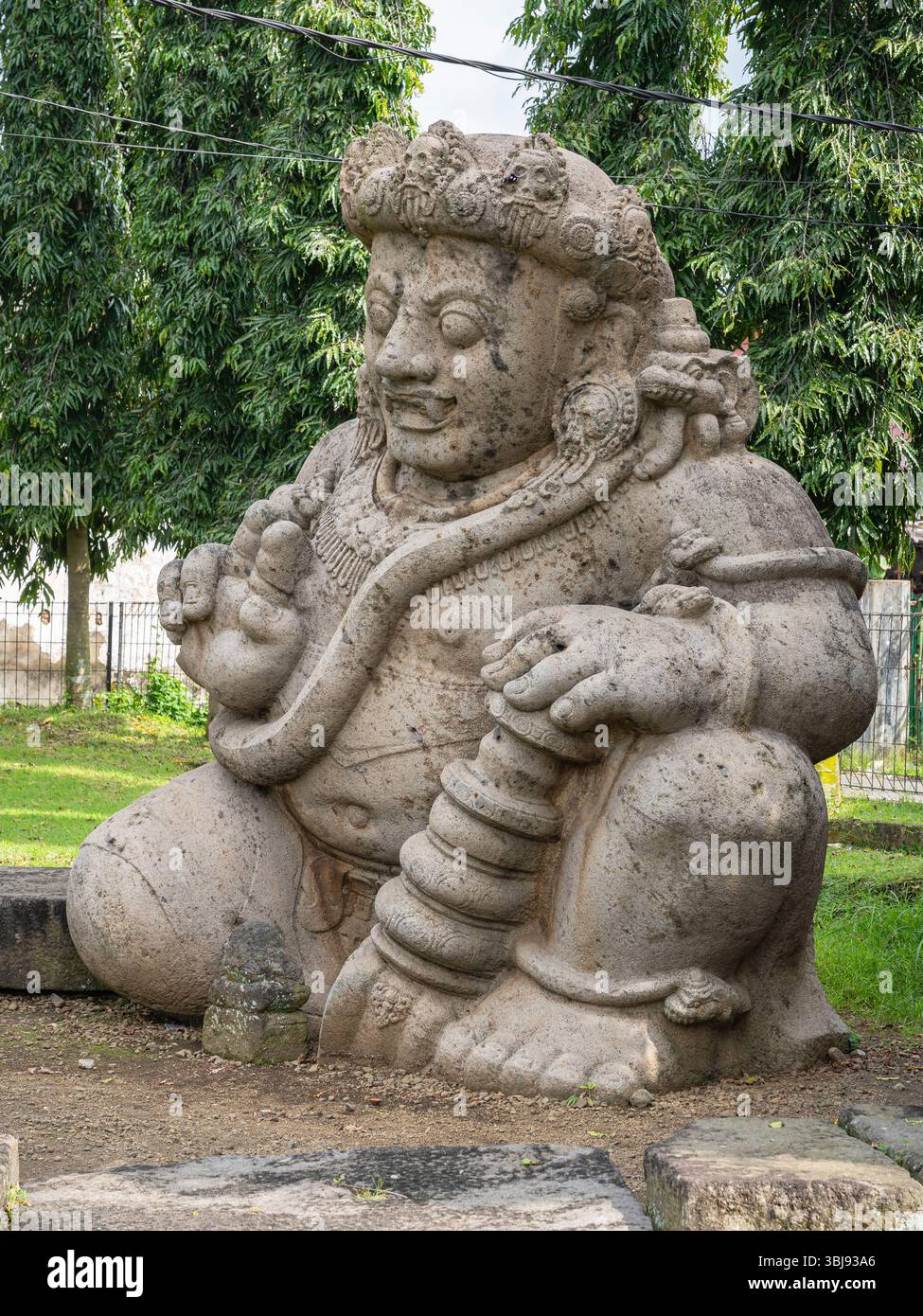 Three-quarter view of ancient giant monolith statue of dvarapala or ...