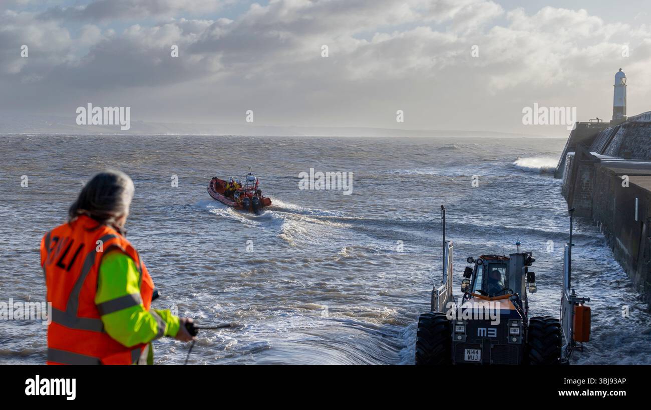 RNLI launches inshore rescue boat during Storm, south Wales coast UK ...