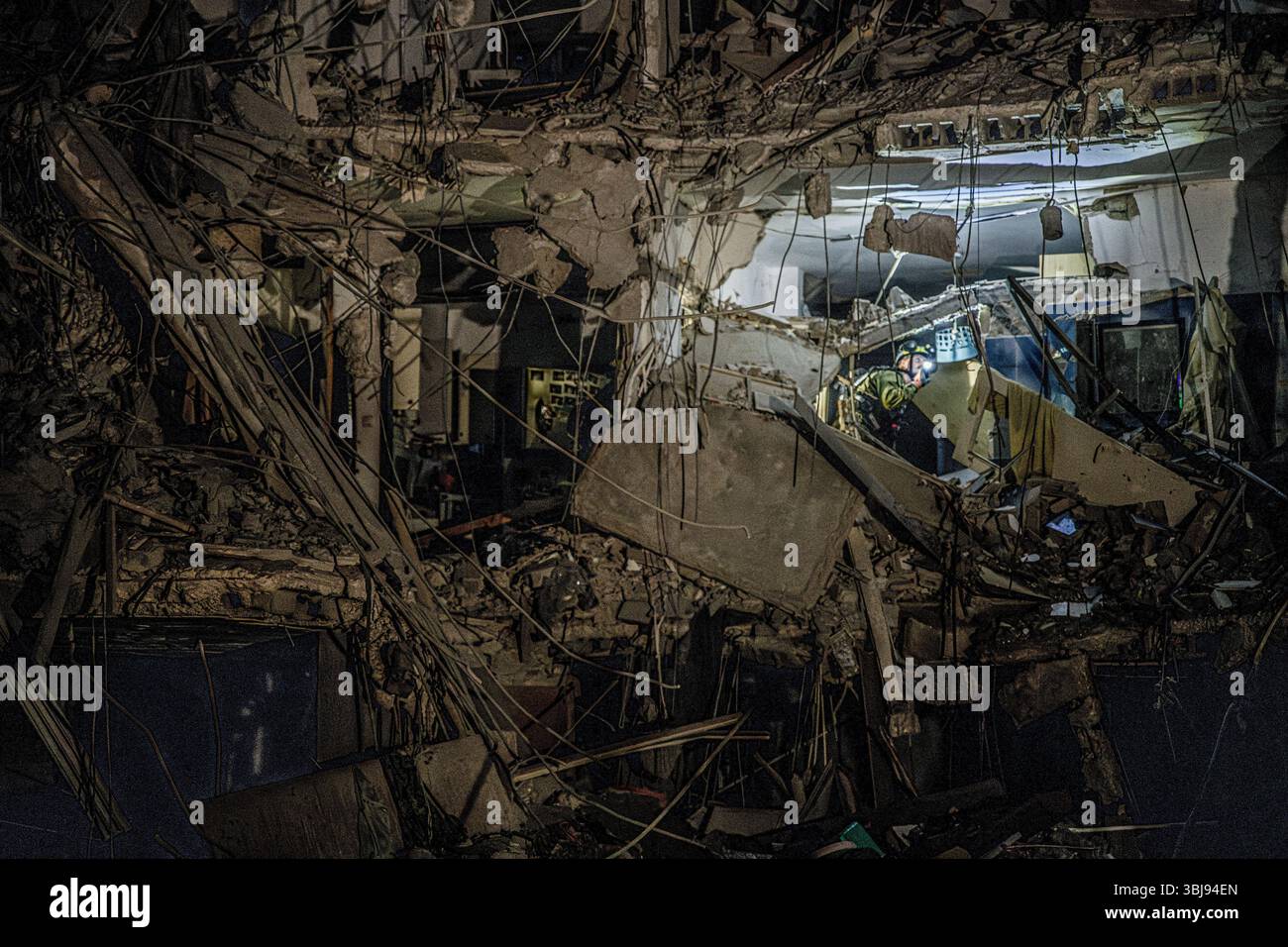 Israeli Home Front Command soldiers inspect a building that was ...
