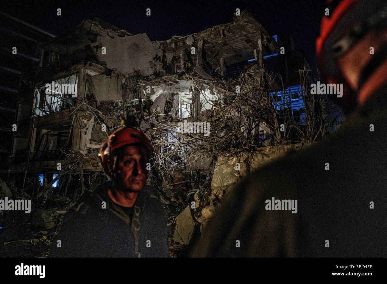 Israeli Home Front Command soldiers inspect a building that was ...