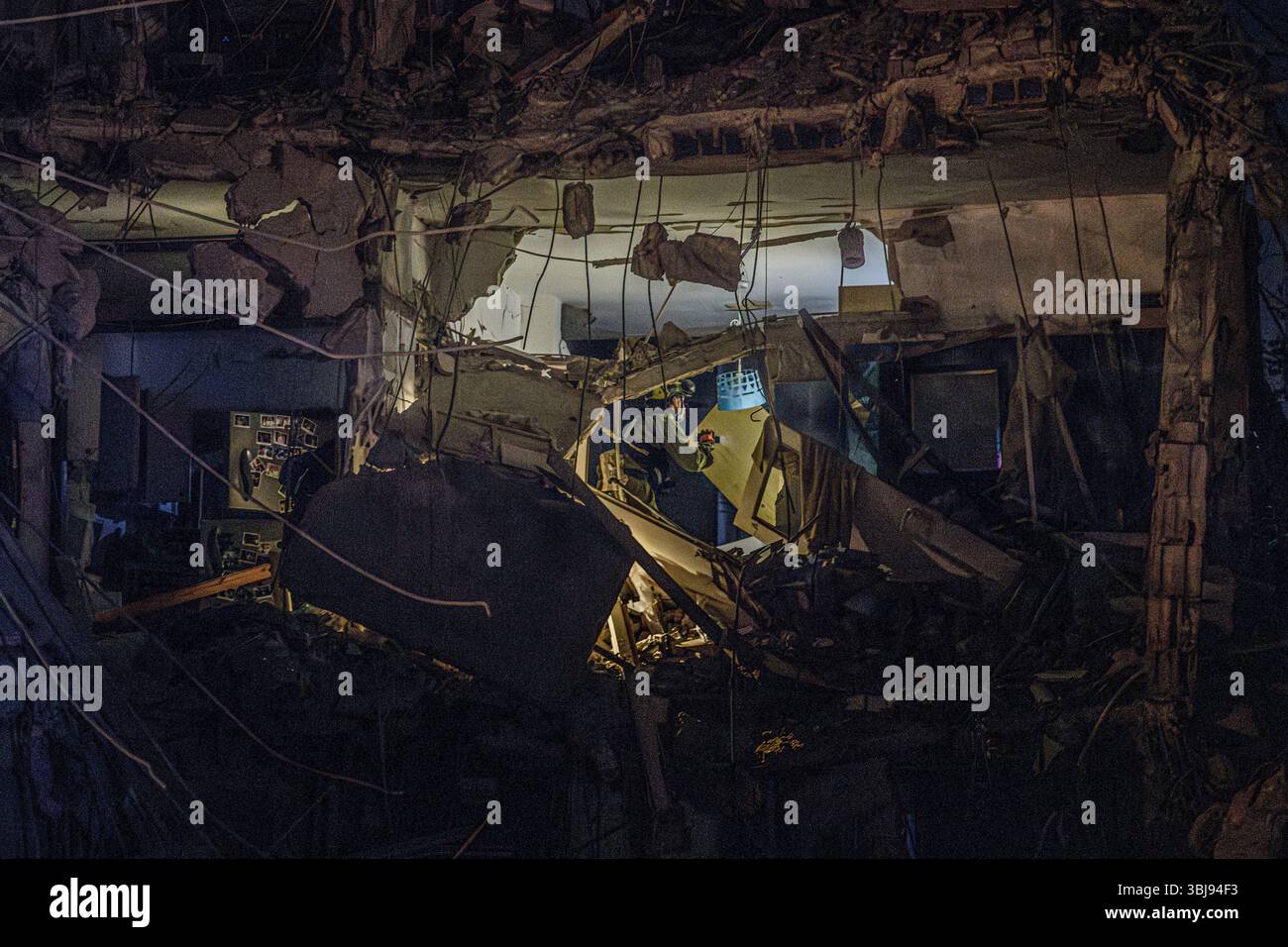 Israeli Home Front Command soldiers inspect a building that was ...
