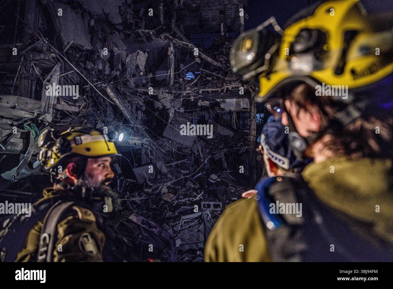 Israeli Home Front Command soldiers inspect a building that was ...