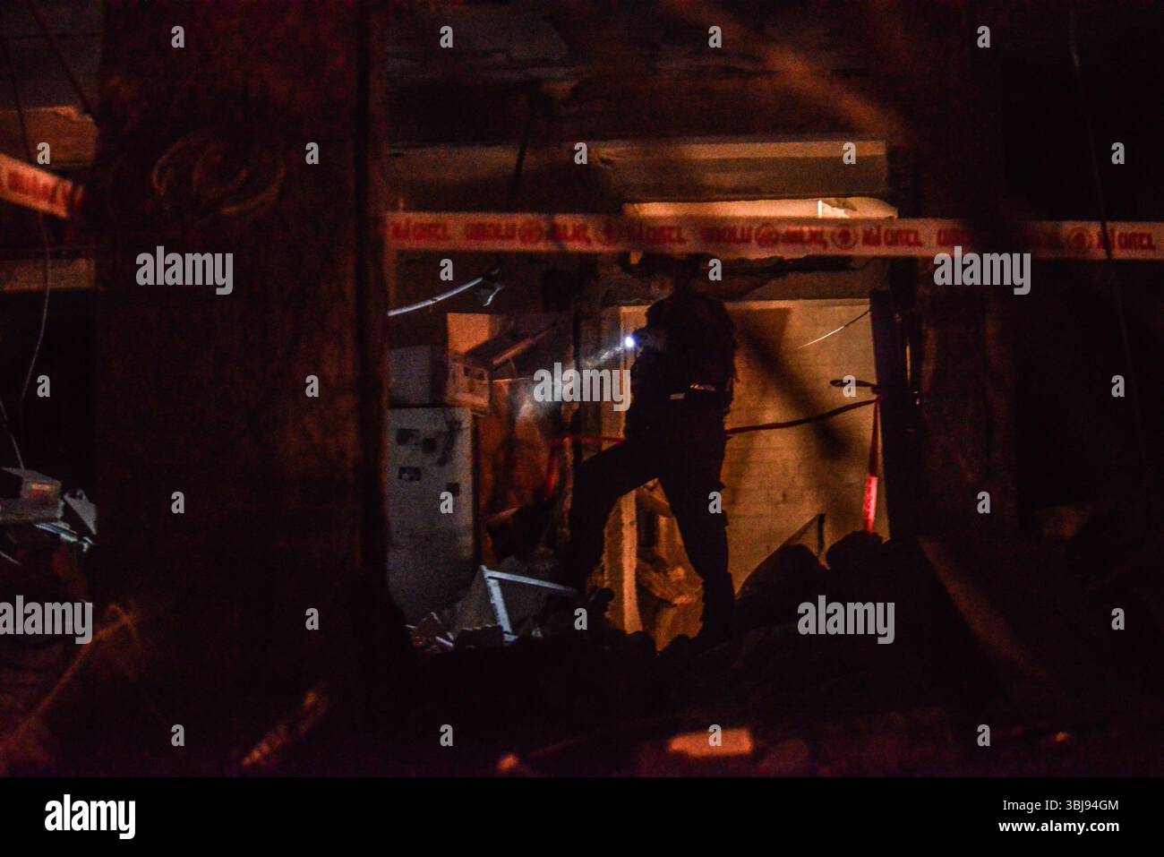 Israeli Home Front Command soldiers inspect a building that was ...