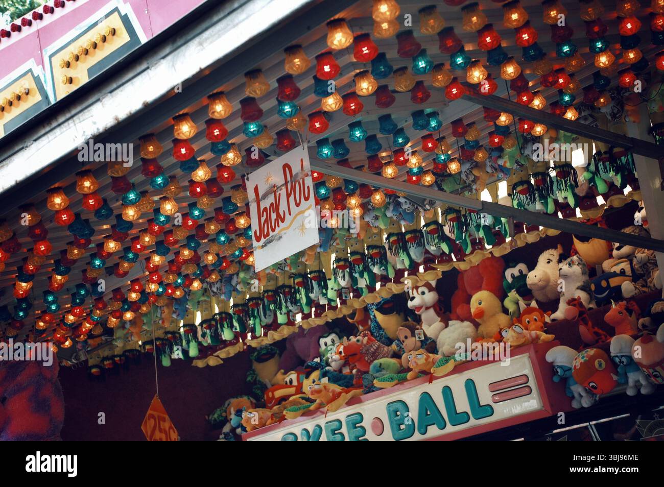 Prizes at a carnival skee ball booth Stock Photo - Alamy