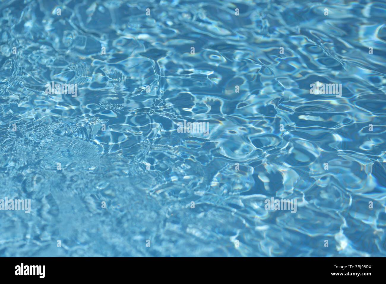 Shallow depth of field details with clear blue and transparent water in ...