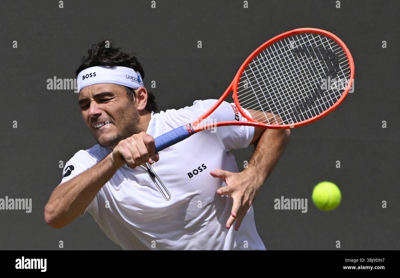 Taylor Fritz of the USA returns a shot to Canada's Felix Auger-Aliassime, during their men's ...