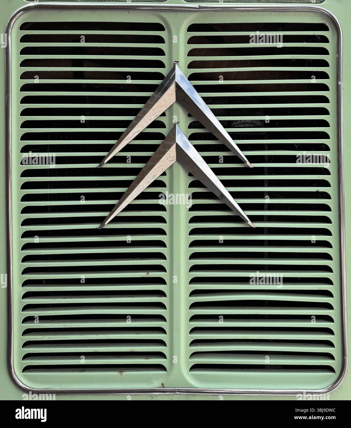 Citroën/Citroen badge or logo on the front of a green radiator grille ...