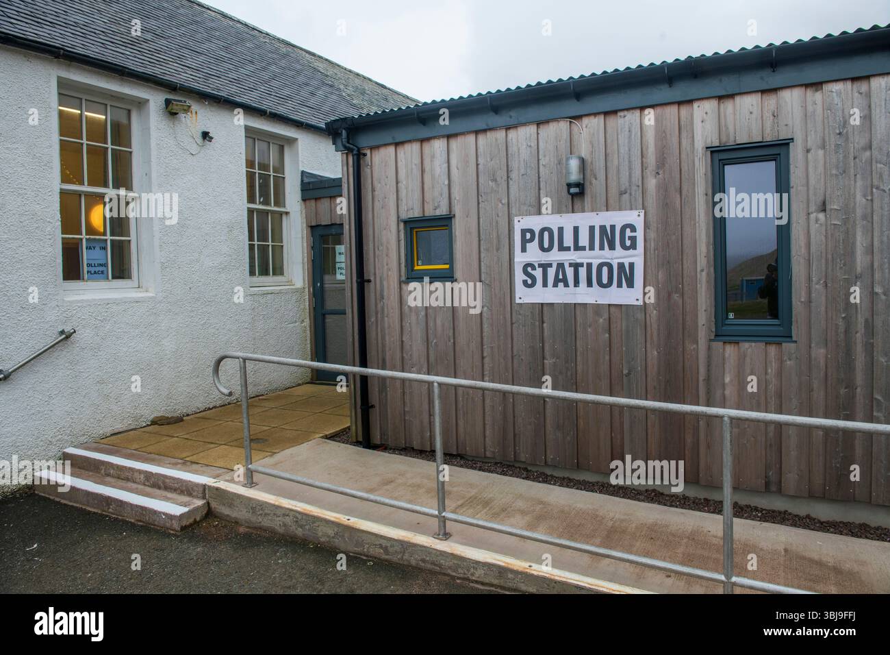 A polling station sign stands outside a rural village hall in Shetland ...