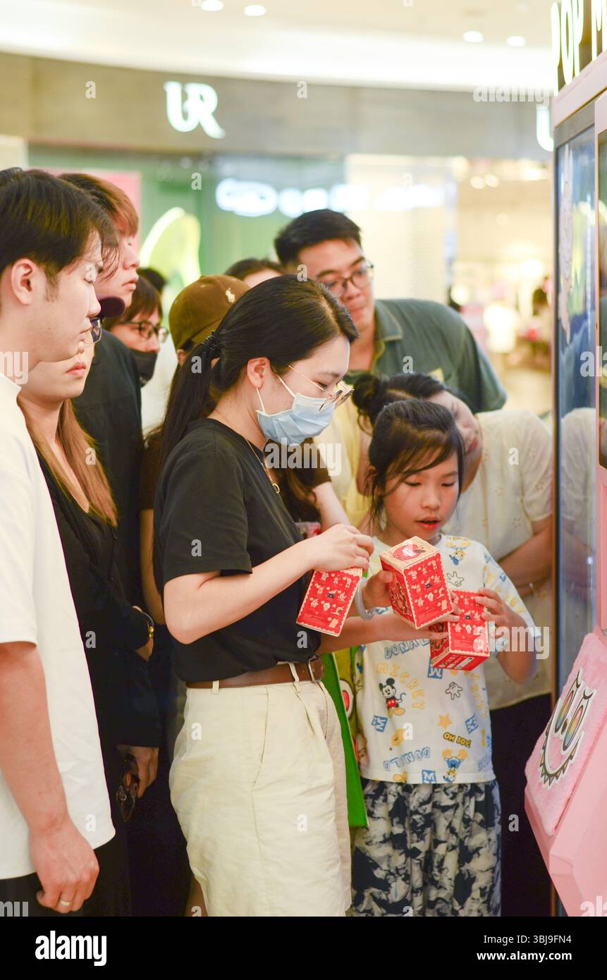 Jiangmen,Guangdong,China.14 June,2025.Customers selecting Labubu Collectibles at Pop Mart Store ...
