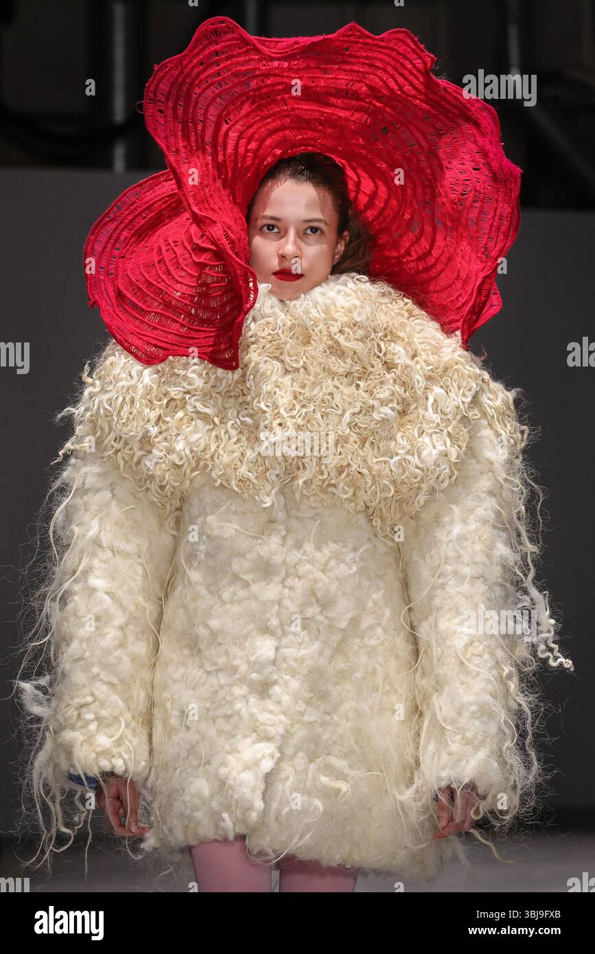 London, UK. 13th June, 2025. Models on the runway at the evening ...