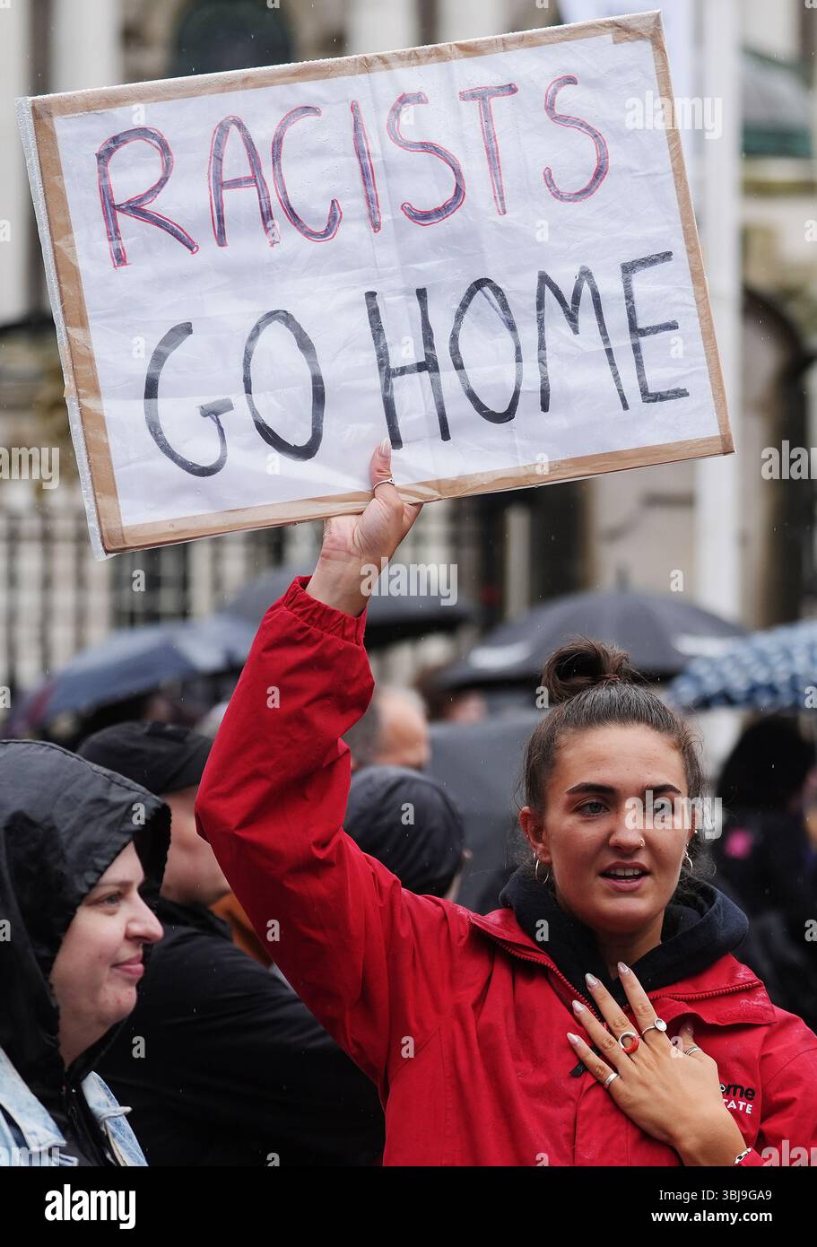 Demonstrators take part in a United Against Racism rally at Belfast ...