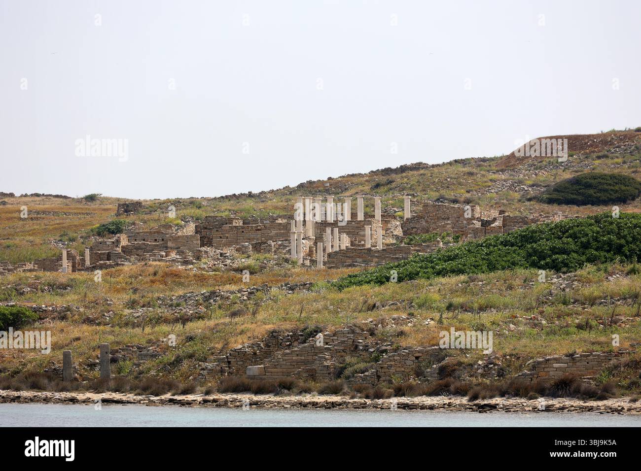 View of the Cycladic island of Delos through the Apollo sanctuary there ...