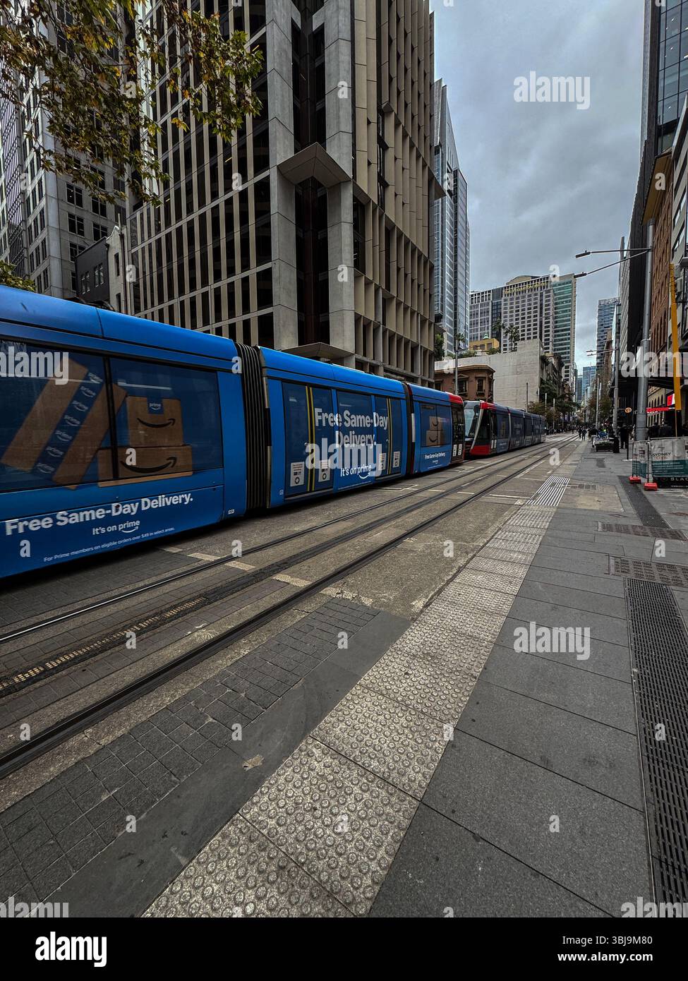 Modern light rail trams on George Street in Sudney's central business ...