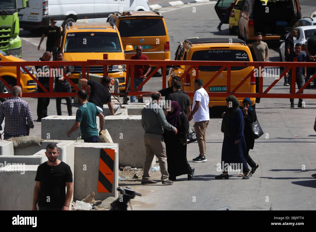 Hebron. 14th June, 2025. Road barriers are seen set up at an entrance ...